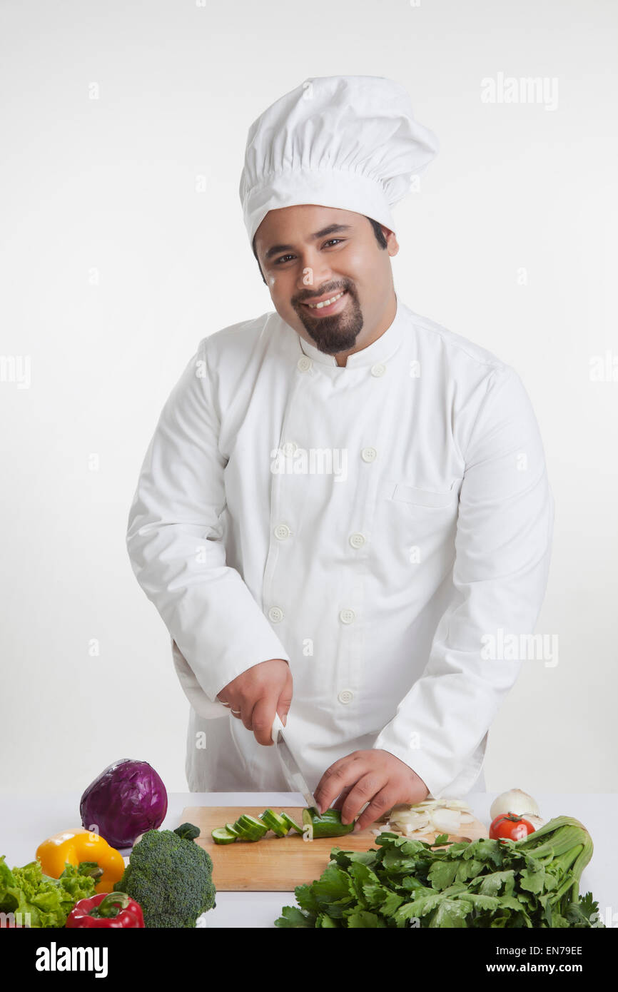 Professional chef cutting tomato hi-res stock photography and images ...