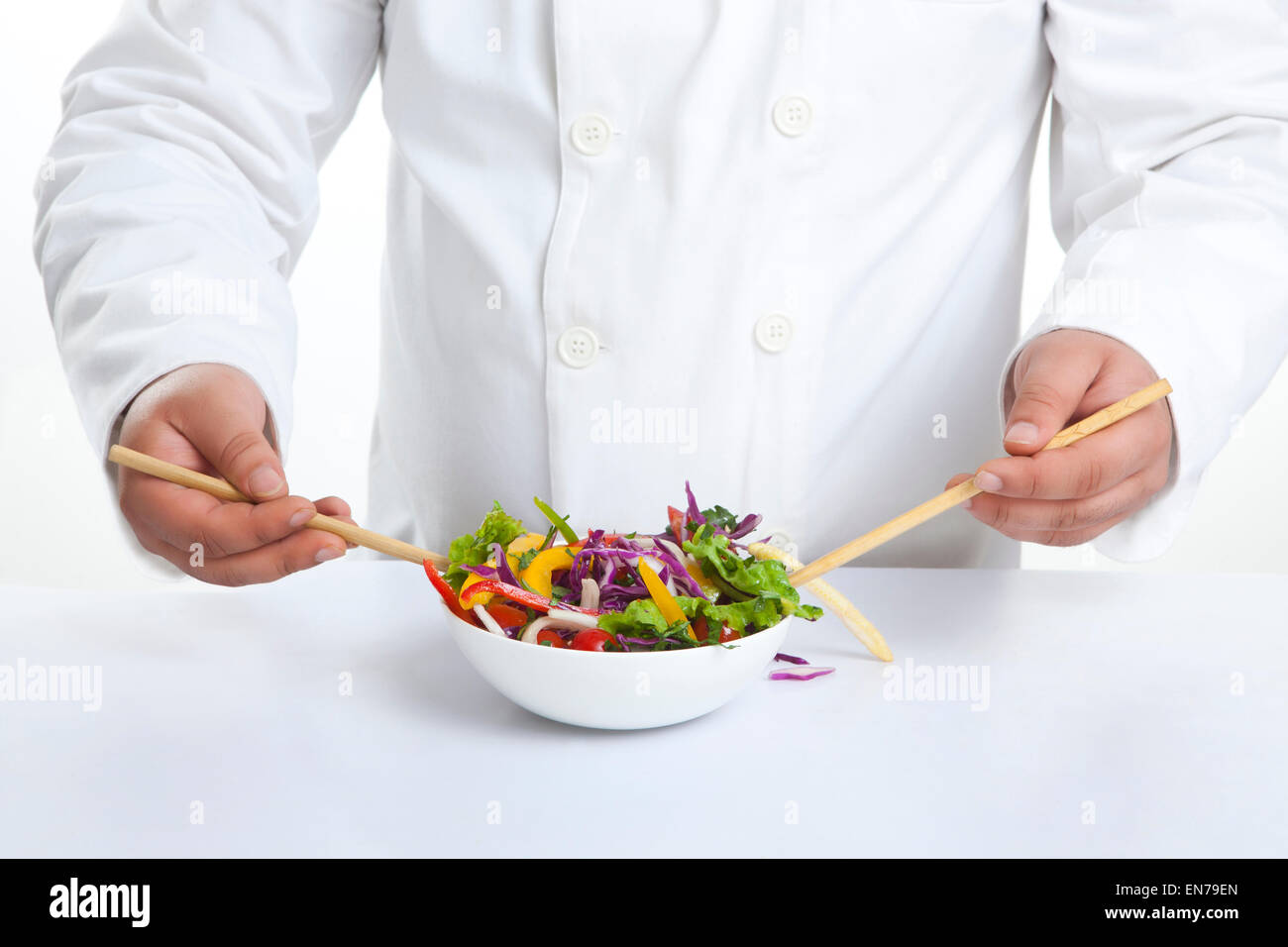 Chef with chopsticks in vegetable bowl Stock Photo - Alamy