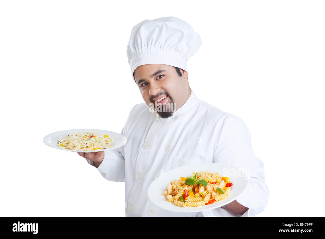 Portrait of chef holding plates with pasta Stock Photo - Alamy