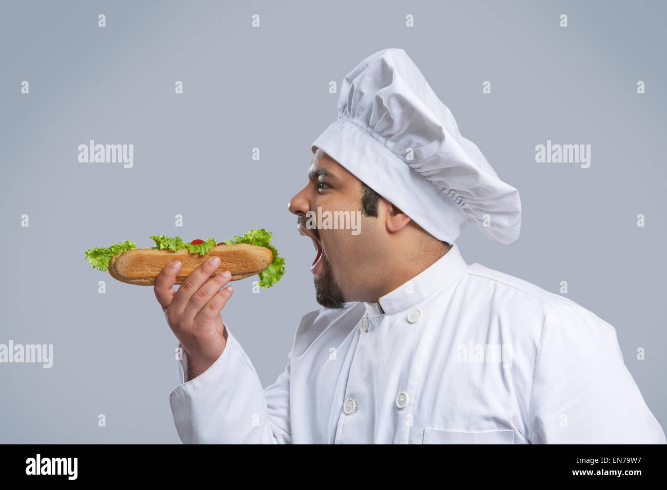 Chef about to eat a sandwich Stock Photo - Alamy