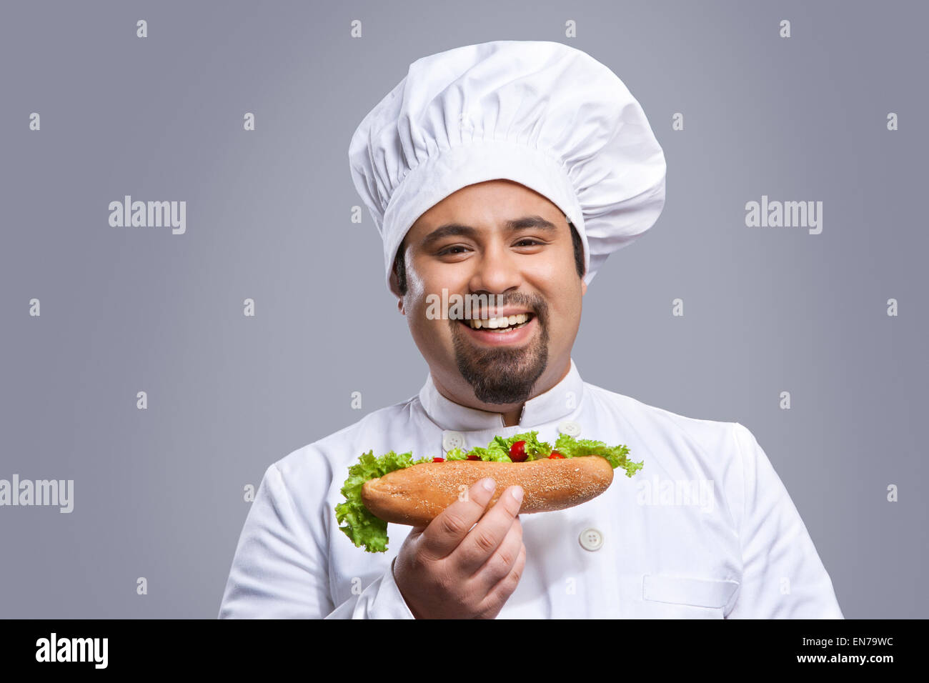 Portrait of chef with sandwich smiling Stock Photo - Alamy