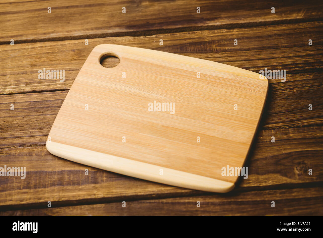 Wooden board on a table Stock Photo - Alamy