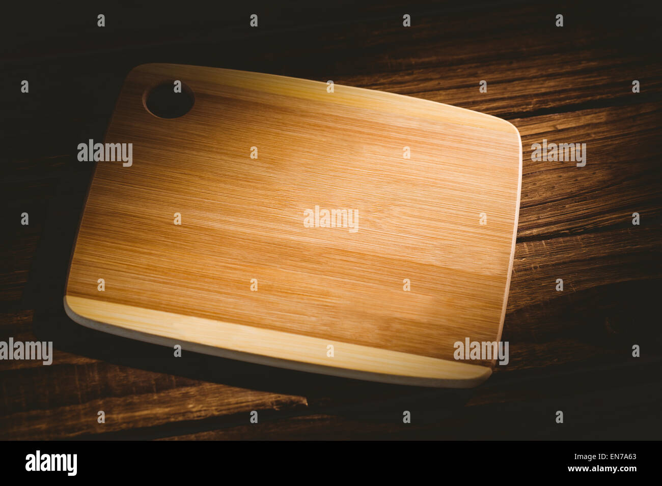 Wooden board on a table Stock Photo - Alamy