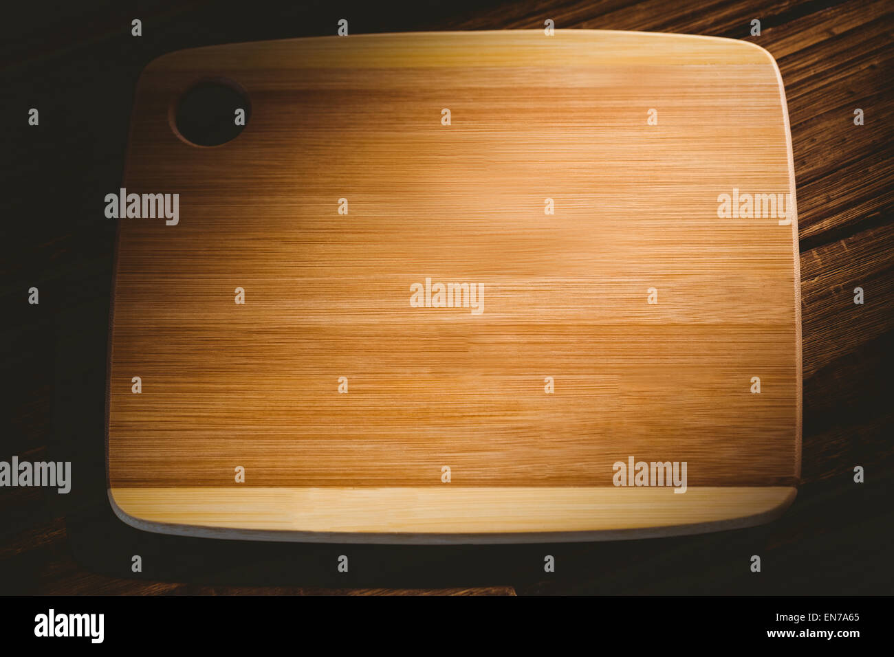 Wooden board on a table Stock Photo - Alamy