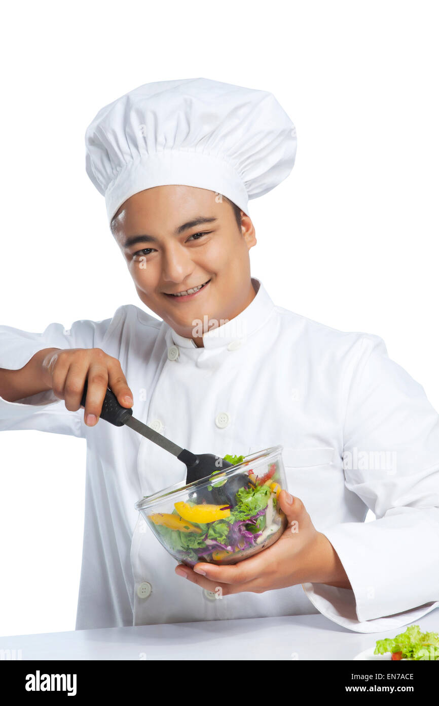 Portrait of chef mixing vegetables in bowl Stock Photo - Alamy