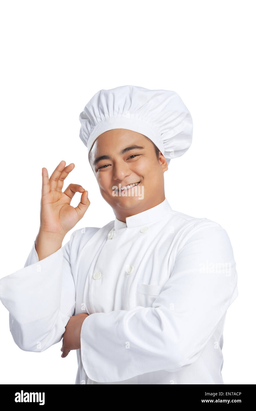 Portrait of chef giving ok hand gesture Stock Photo - Alamy