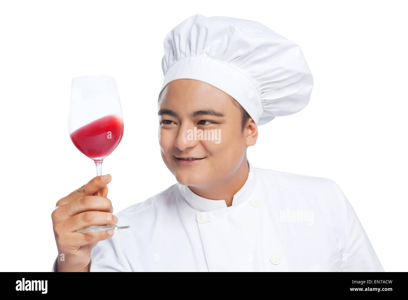 Chef holding glass with wine Stock Photo - Alamy