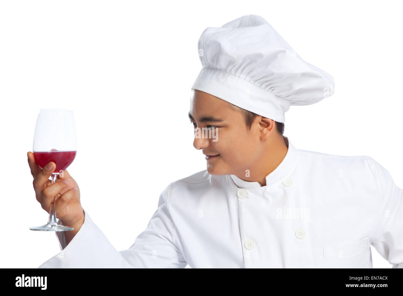 Chef holding glass with wine Stock Photo - Alamy