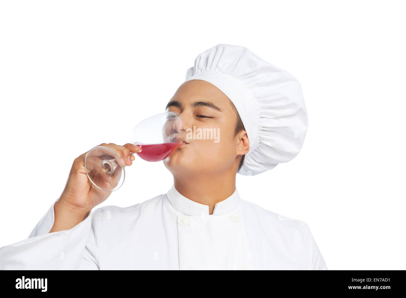 Chef drinking wine from glass Stock Photo - Alamy