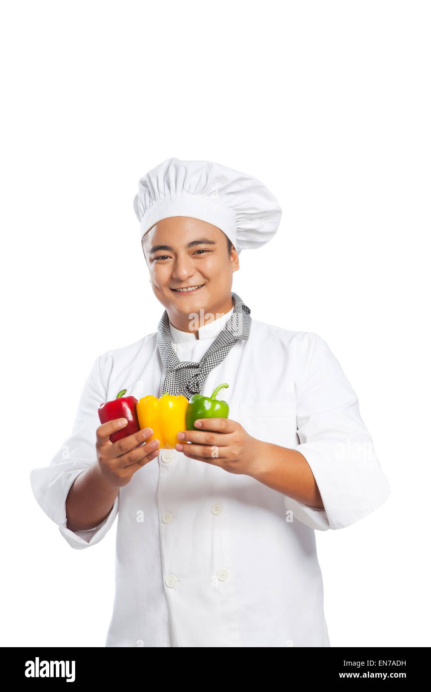Portrait of chef holding capsicum Stock Photo - Alamy