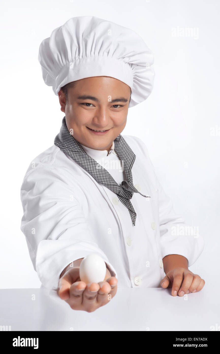 Portrait of chef with egg Stock Photo - Alamy