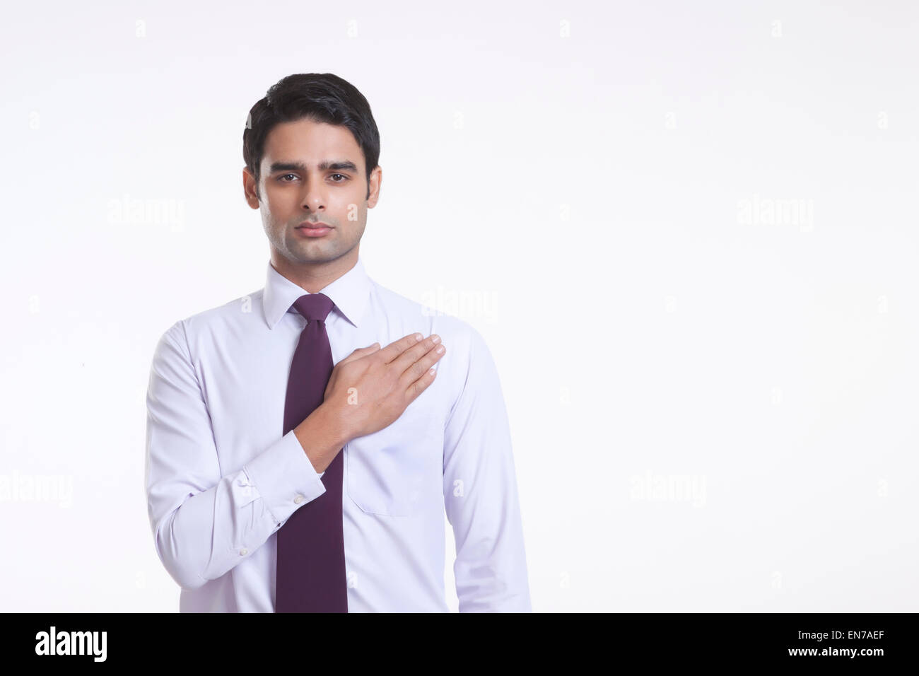 Portrait of a male executive taking an oath Stock Photo - Alamy