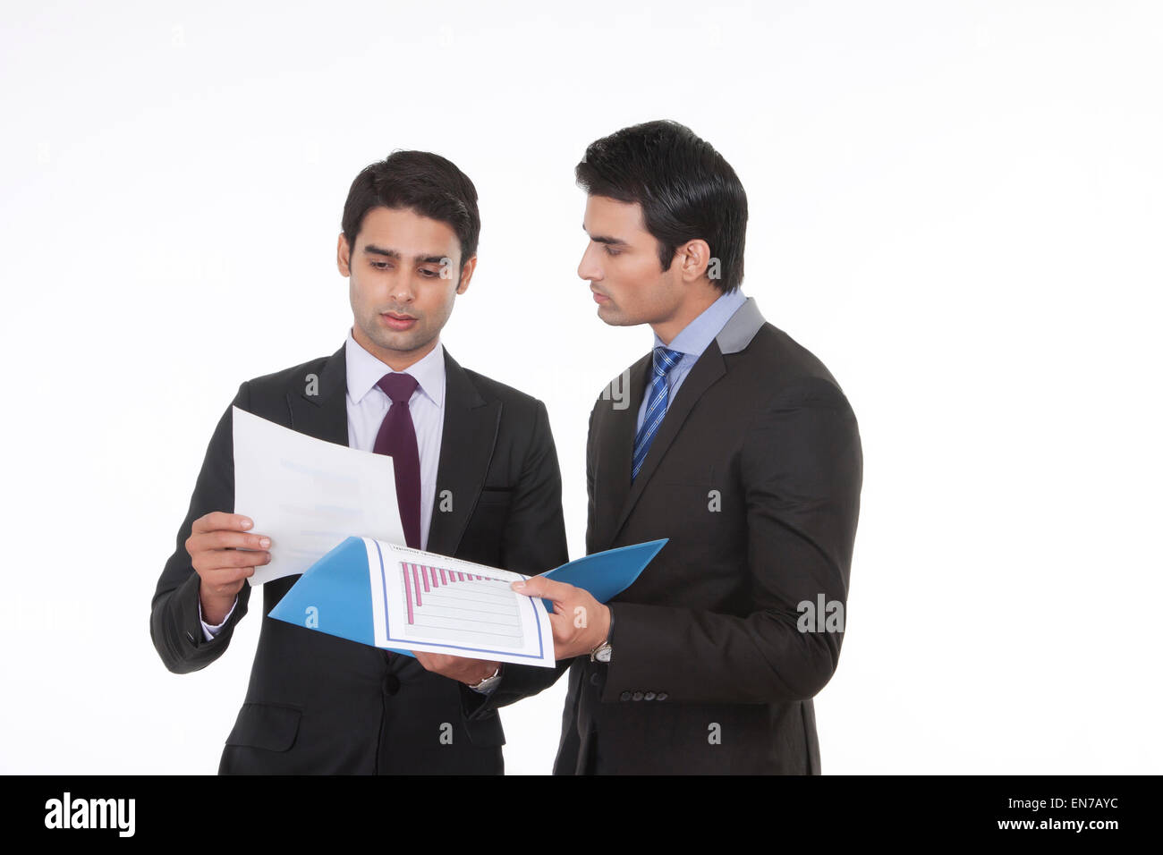 Two businessmen with a file Stock Photo - Alamy