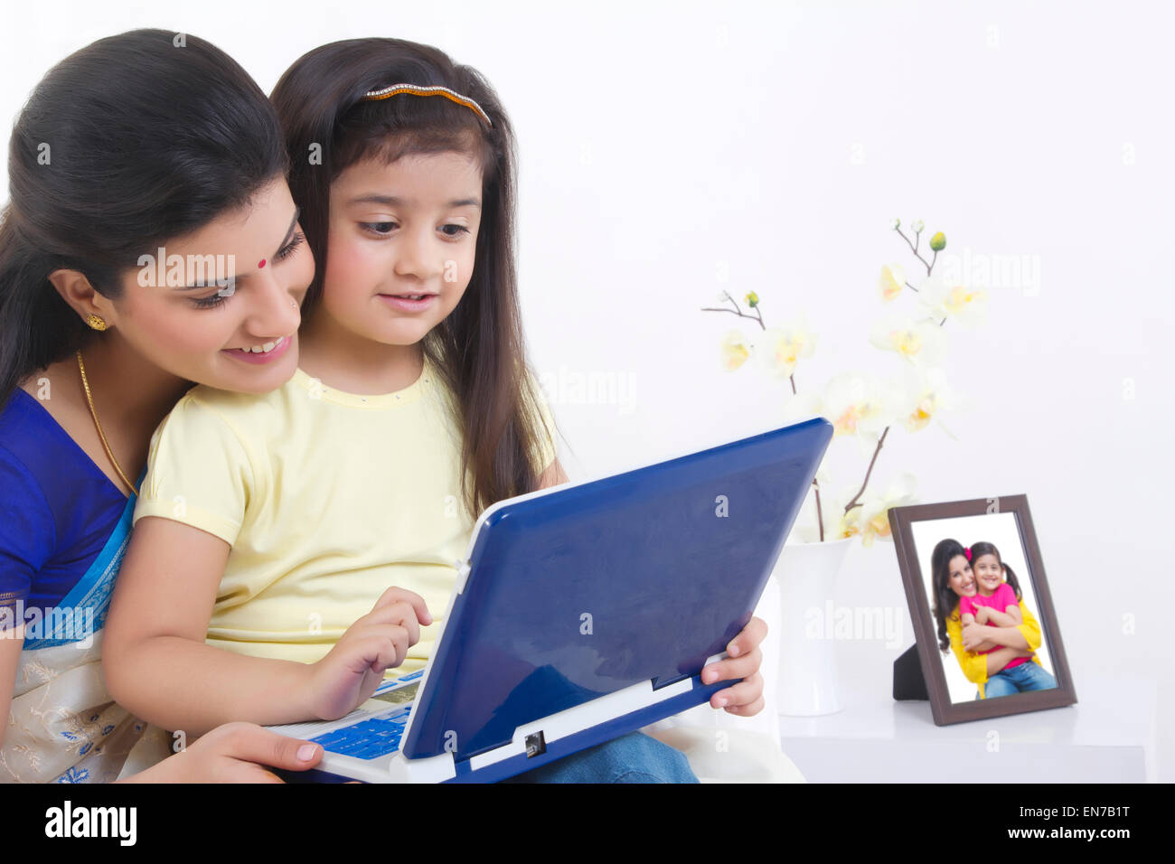 Mother and daughter with a computer Stock Photo - Alamy