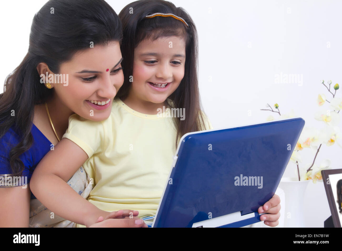 Mother and daughter with a computer Stock Photo - Alamy