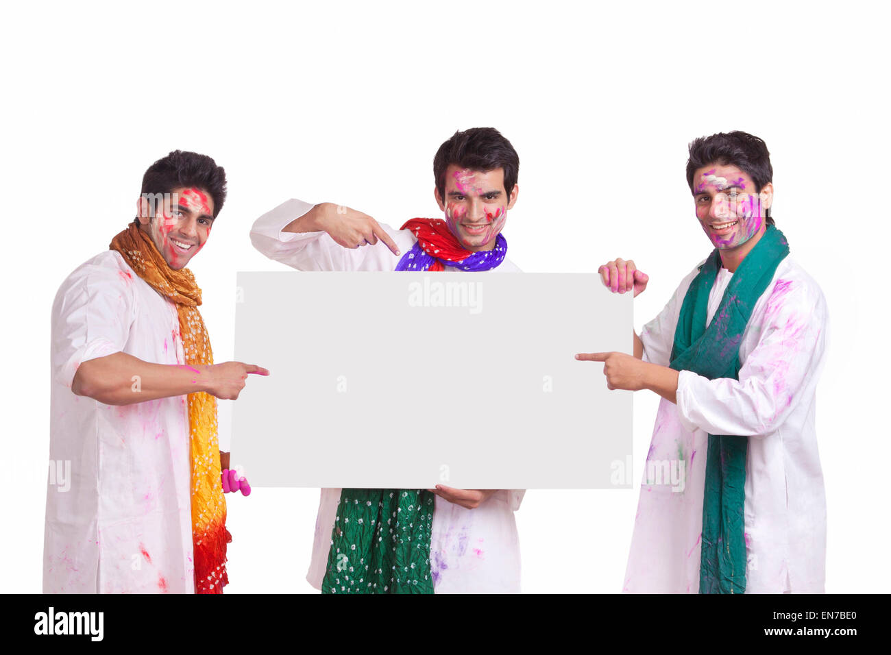 Portrait of friends pointing to a white board Stock Photo - Alamy