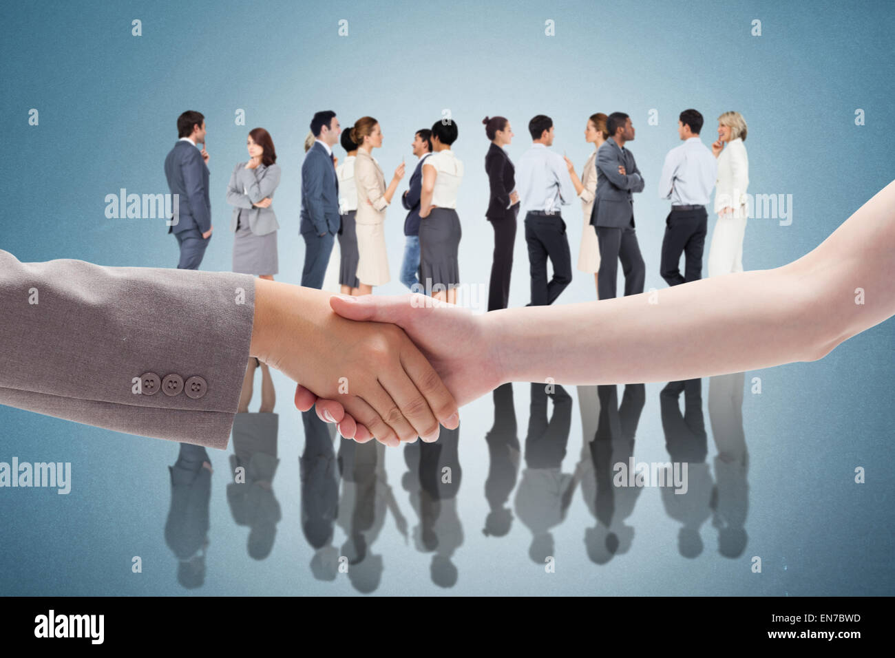 Composite image of handshake between two women Stock Photo - Alamy