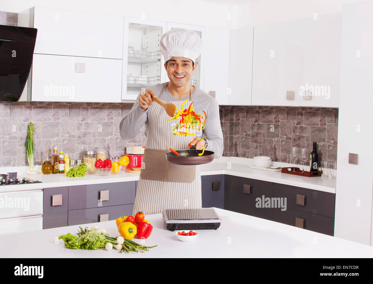 Portrait of a man cooking Stock Photo - Alamy
