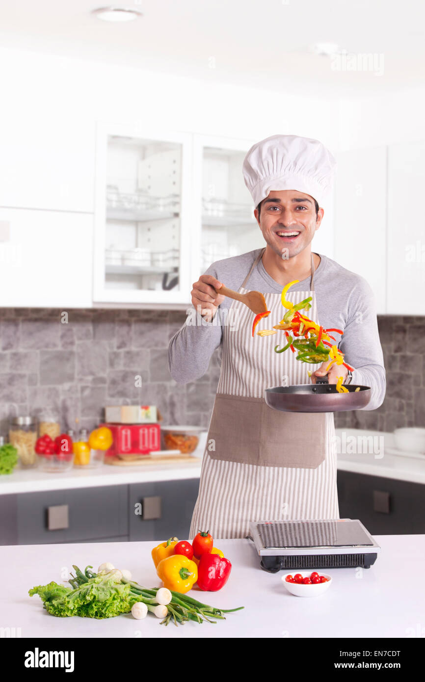Portrait of a man cooking Stock Photo - Alamy