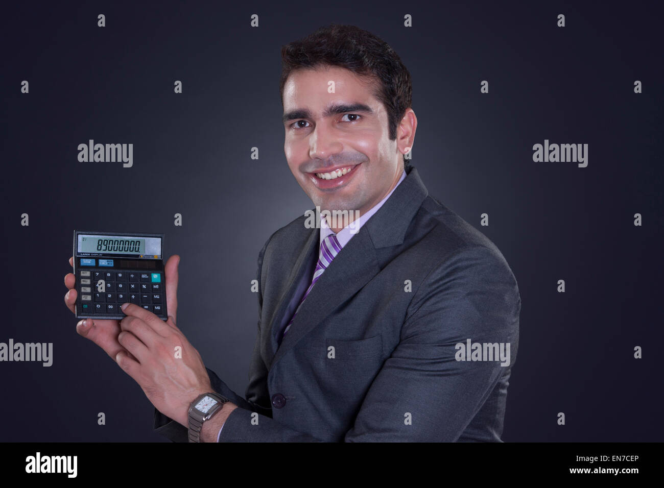 Businessman smiling happiness calculator hi-res stock photography and ...