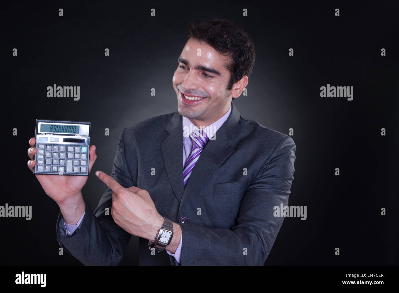 Young businessman in office calculator hi-res stock photography and ...