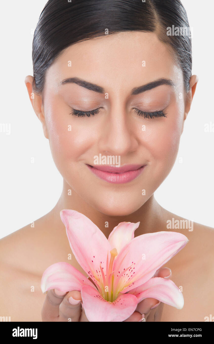 Beautiful woman with a flower Stock Photo - Alamy