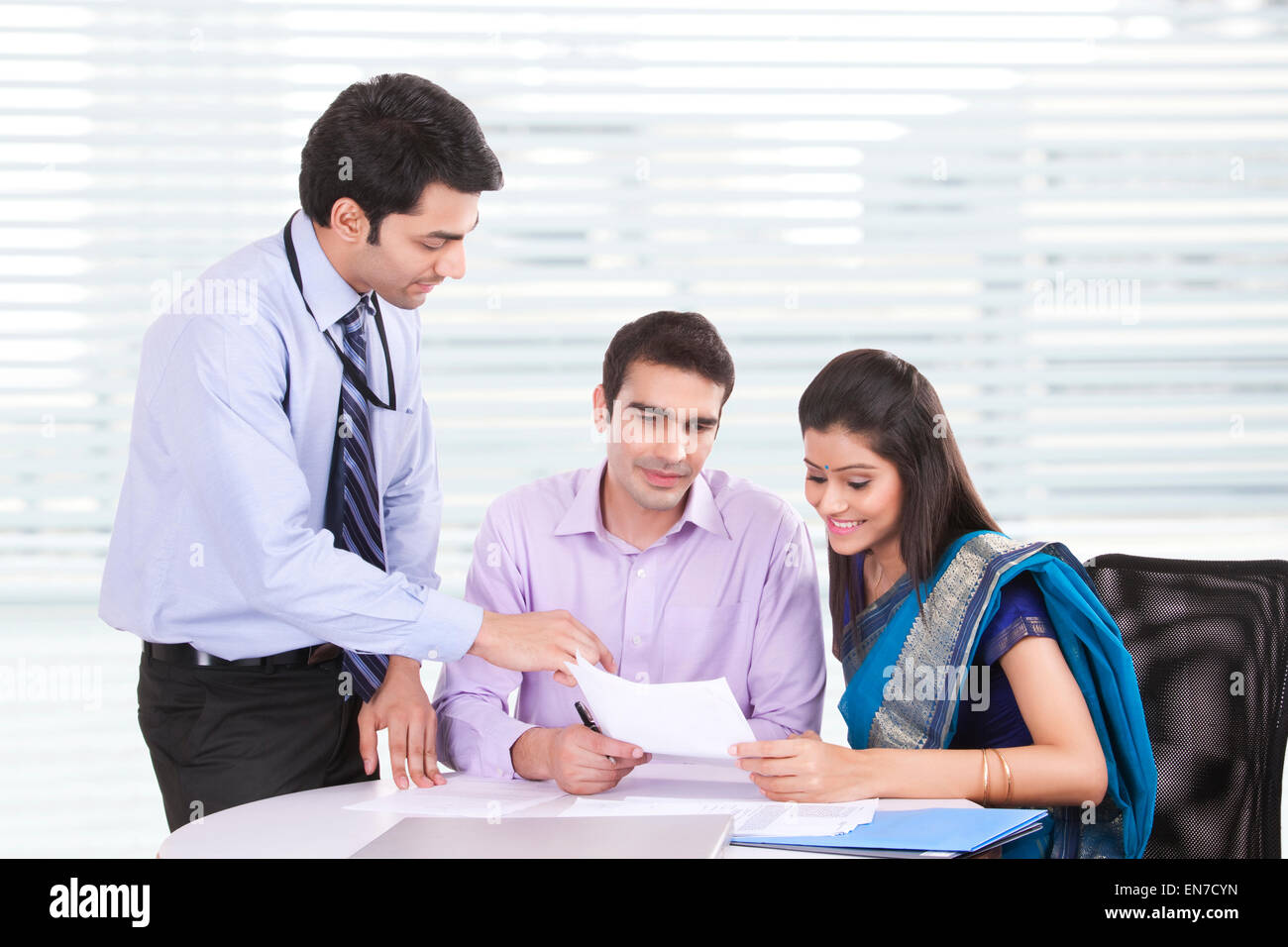 Couple looking at documents Stock Photo - Alamy