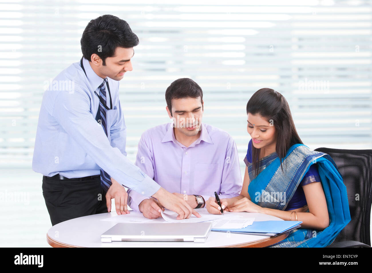 Couple signing documents Stock Photo - Alamy