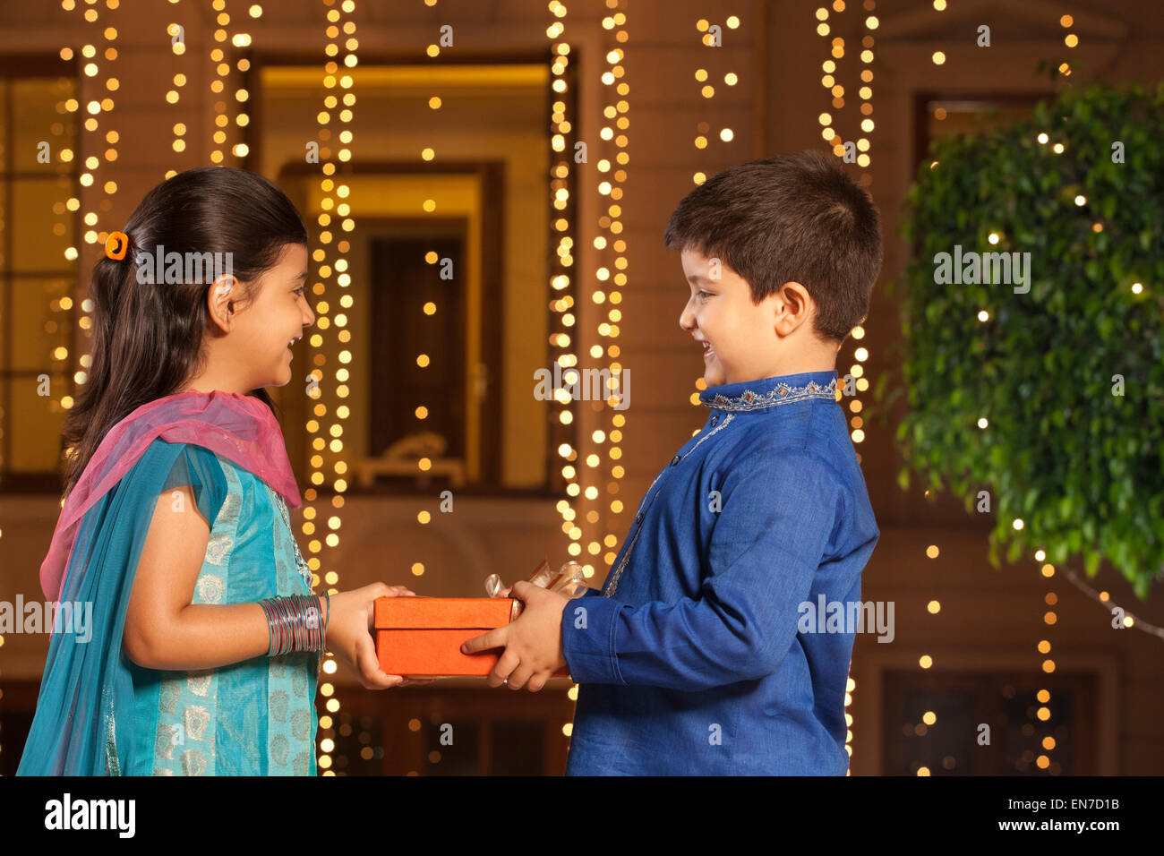 Children holding gift Stock Photo - Alamy