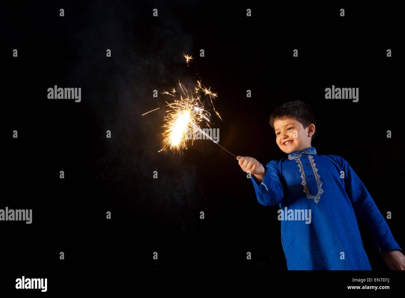 Boy playing with sparkler Stock Photo - Alamy