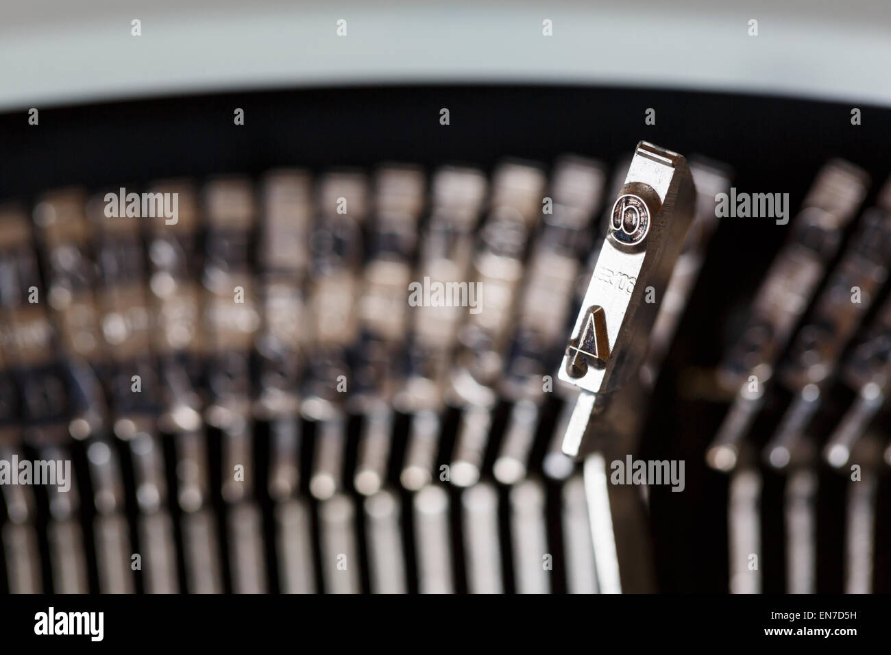 At @ symbol and number four on a metal typewriter striking type key ...