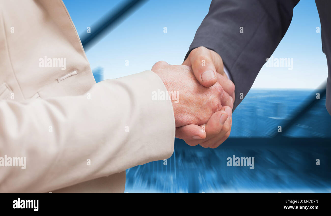 Composite image of business people shaking hands Stock Photo - Alamy
