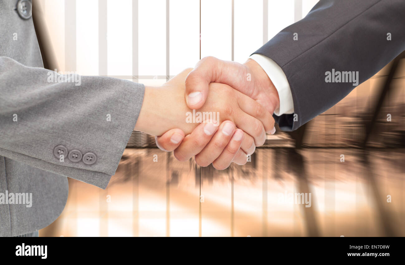 Composite image of handshake between two business people Stock Photo ...