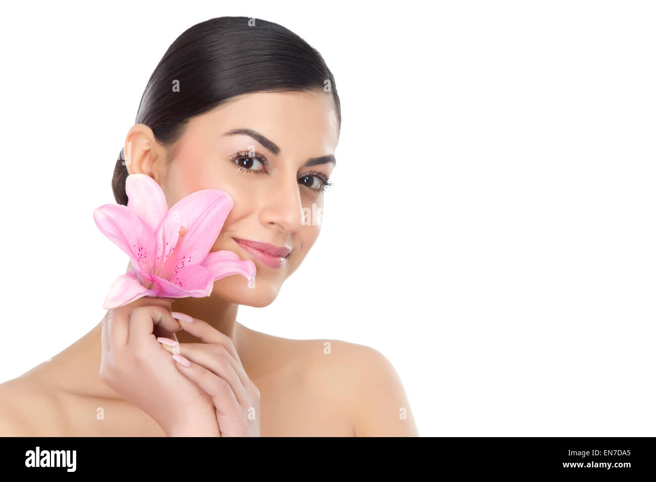 Portrait of a beautiful woman with a flower Stock Photo - Alamy