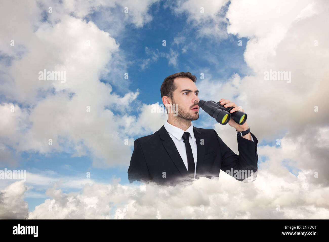 Composite image of surprised businessman standing and holding ...