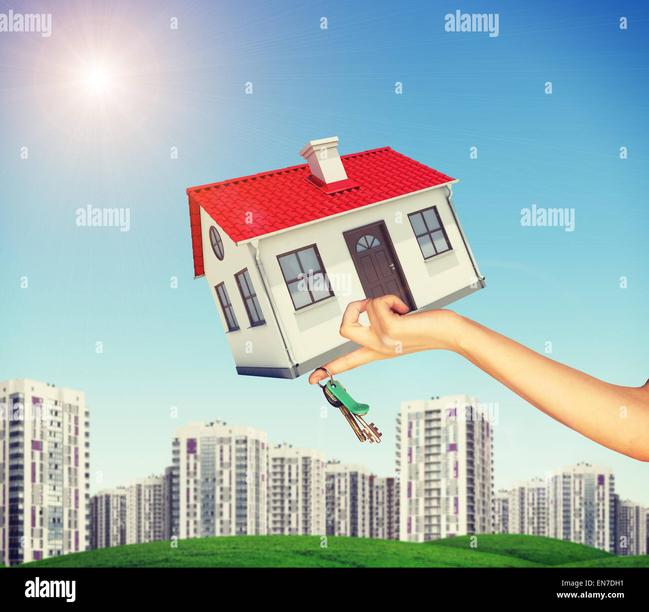 House and keys in womans left hand on cityscape Stock Photo - Alamy