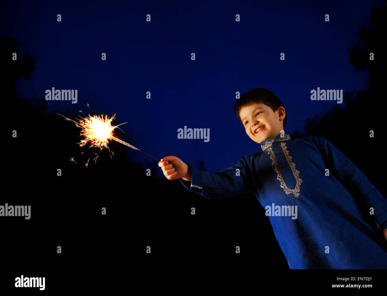 Boy playing with sparkler Stock Photo - Alamy