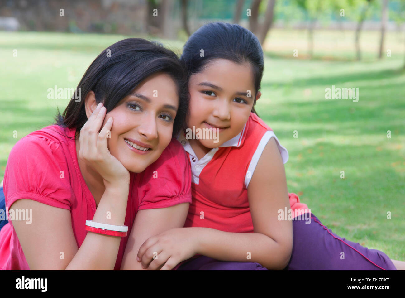 Portrait of mother and daughter in park Stock Photo - Alamy