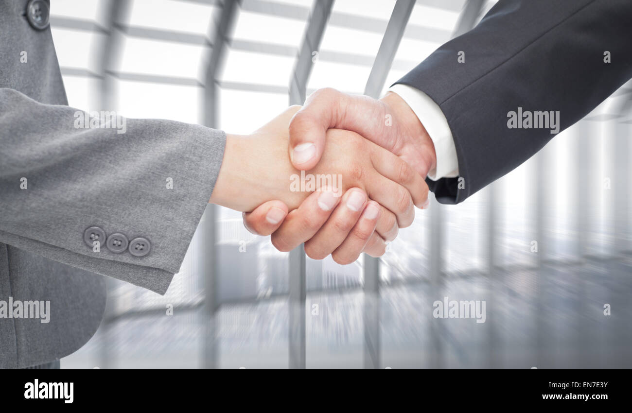 Composite image of handshake between two business people Stock Photo ...