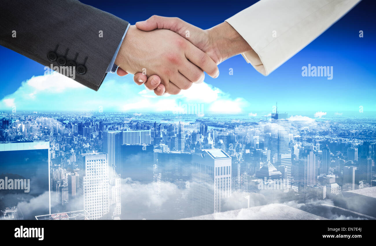 Composite image of shaking hands Stock Photo - Alamy