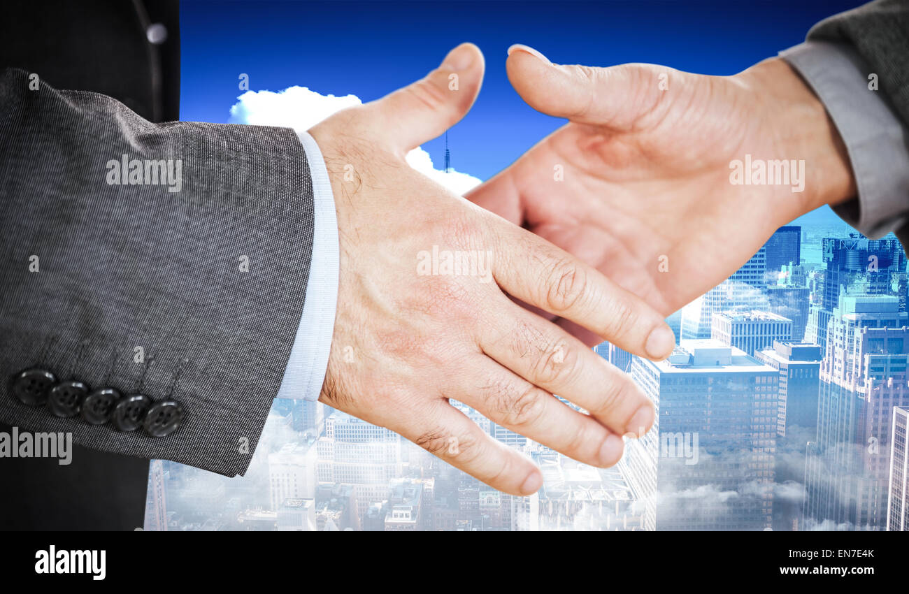 Composite image of two people going to shake their hands Stock Photo ...