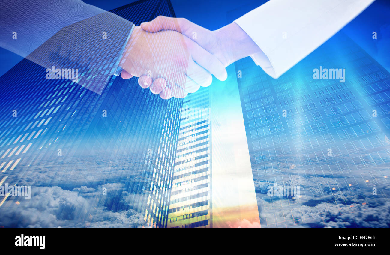 Composite image of shaking hands Stock Photo - Alamy