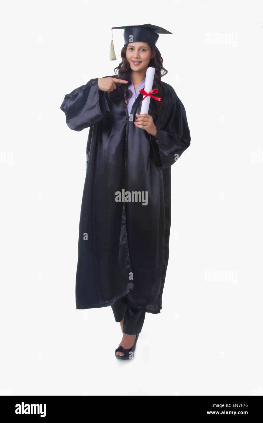 Portrait of woman in graduation gown Stock Photo - Alamy