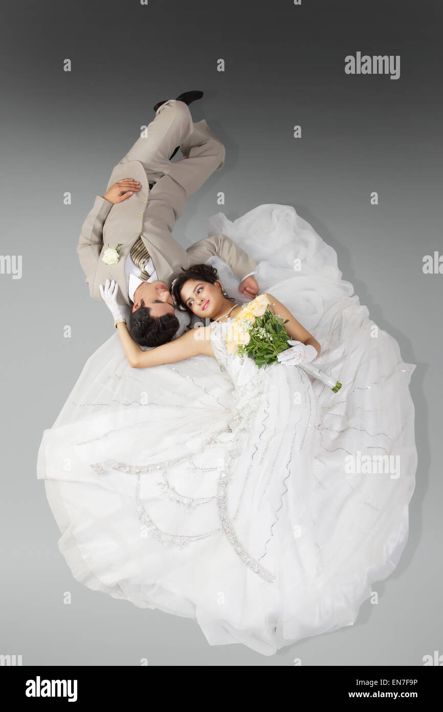 Bride lying down hi-res stock photography and images - Alamy