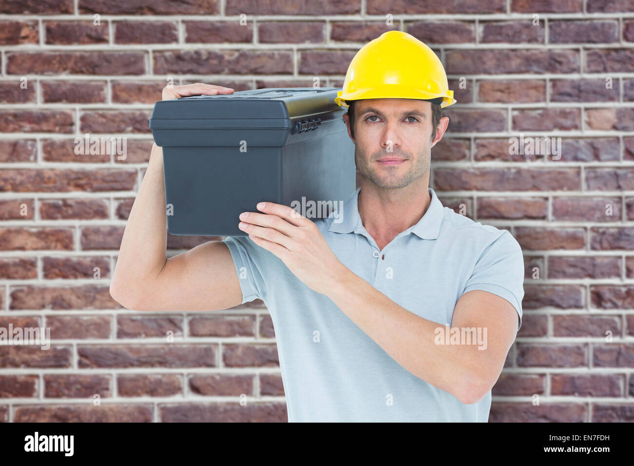 Composite image of confident worker carrying tool box on shoulder Stock ...