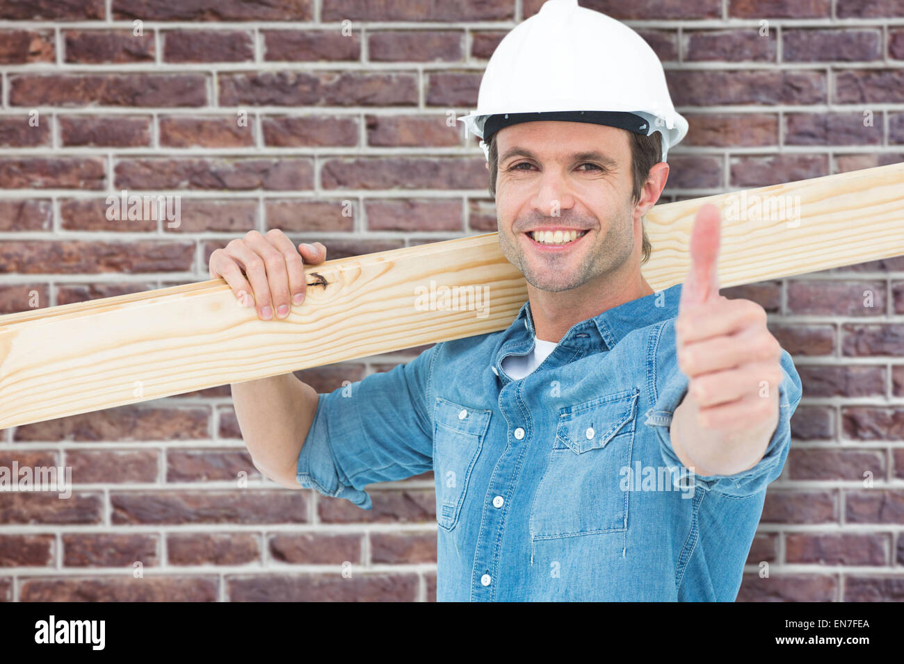 Composite image of confident carpenter carrying wooden plank Stock ...