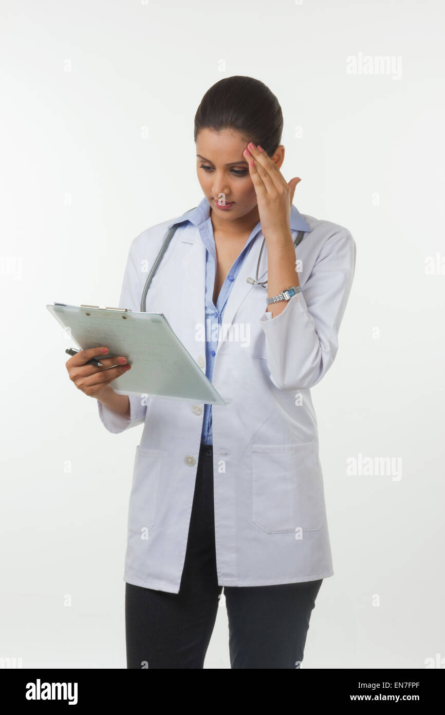 Female doctor thinking Stock Photo - Alamy