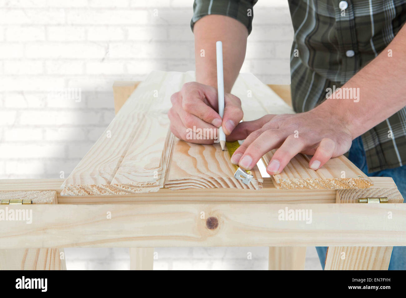 Composite image of carpenter marking on wooden plank Stock Photo - Alamy