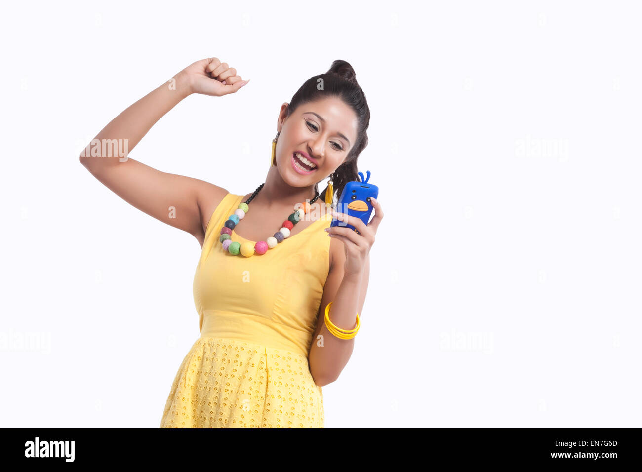 Woman looking at mobile phone and rejoicing Stock Photo - Alamy