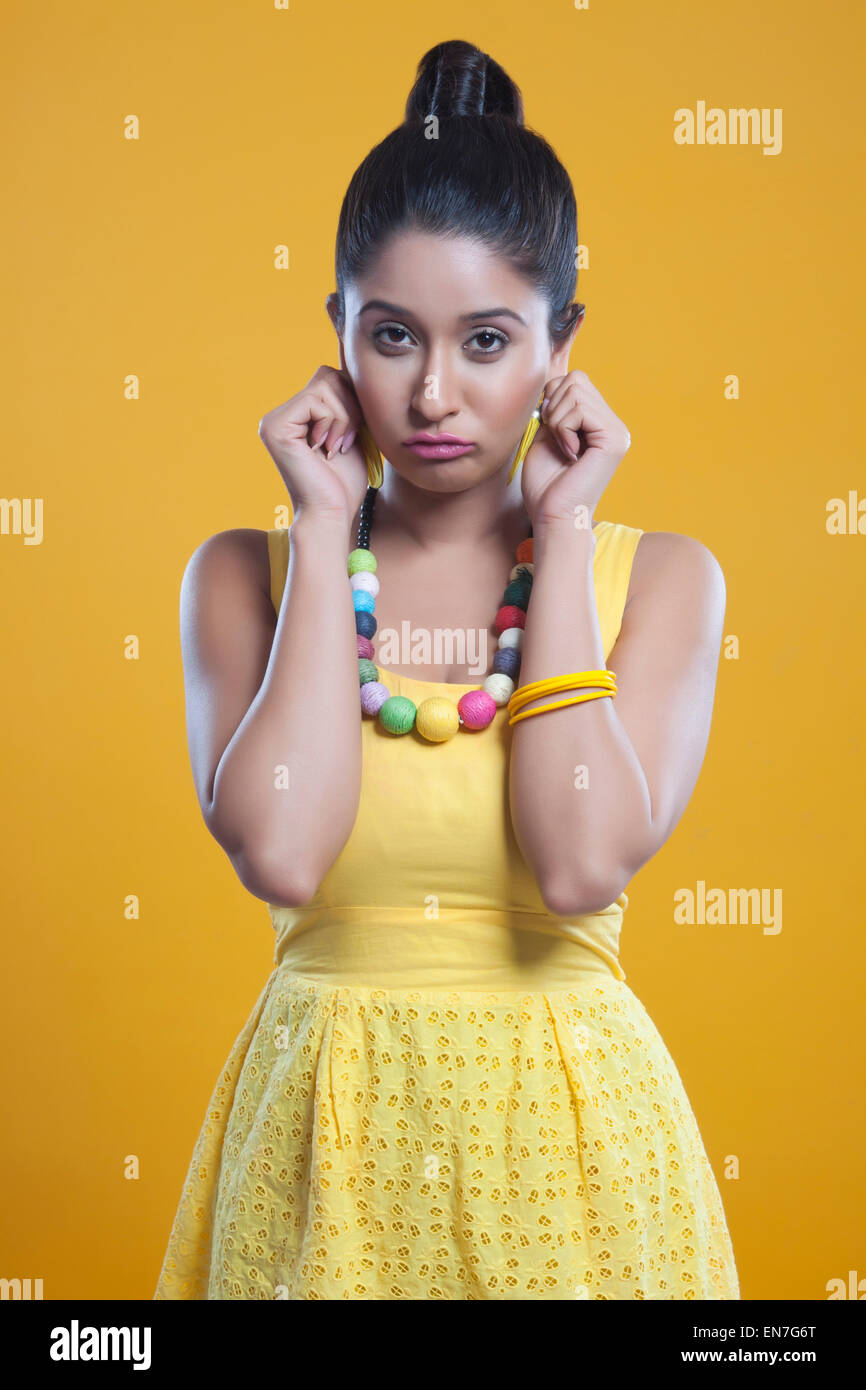 Young woman apologizing Stock Photo - Alamy